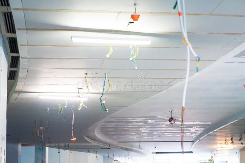 Electric Cables Hanging from Ceiling in a Construction Site. Work in ...