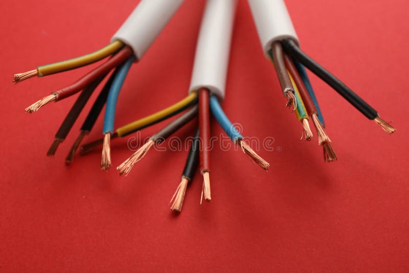 Electric Cables with Wires on Red Background, Closeup View Stock Image ...
