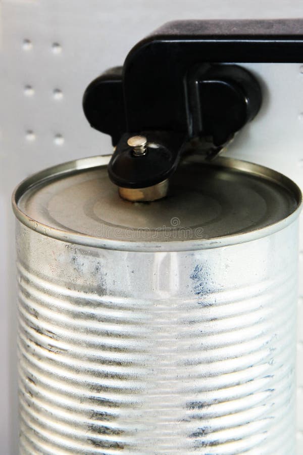 Electric Can Opener and Canned Goods on Table Stock Photo - Image of ...