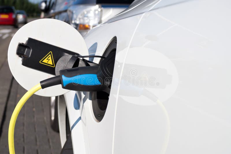 Electric car being charged stock photo. Image of filler - 74296986