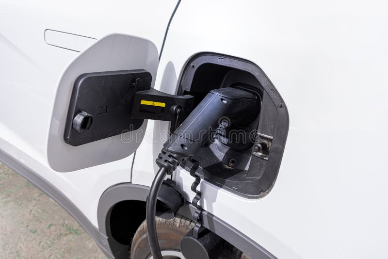 Electric Car Charging the Battery from the Electric Charger Stock Photo ...