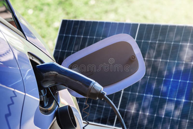 Electric Car Charging from a Solar Panel Close-up Stock Photo - Image ...