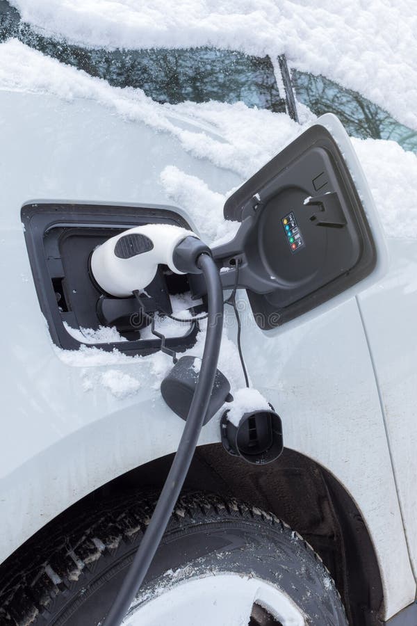 Electric Car Plug Charging In The Winter Stock Photo - Image of battery ...