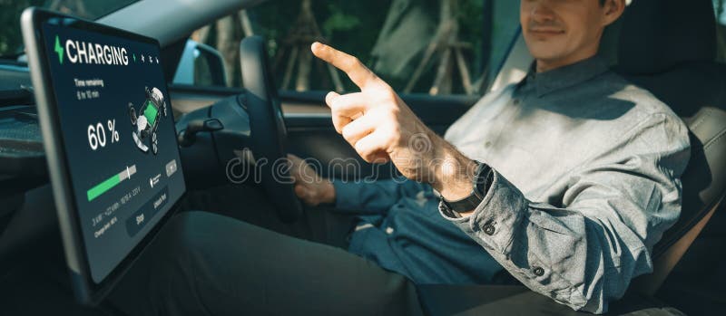 Electric Car Driver Checks Battery Charging Status App Screen in Car ...