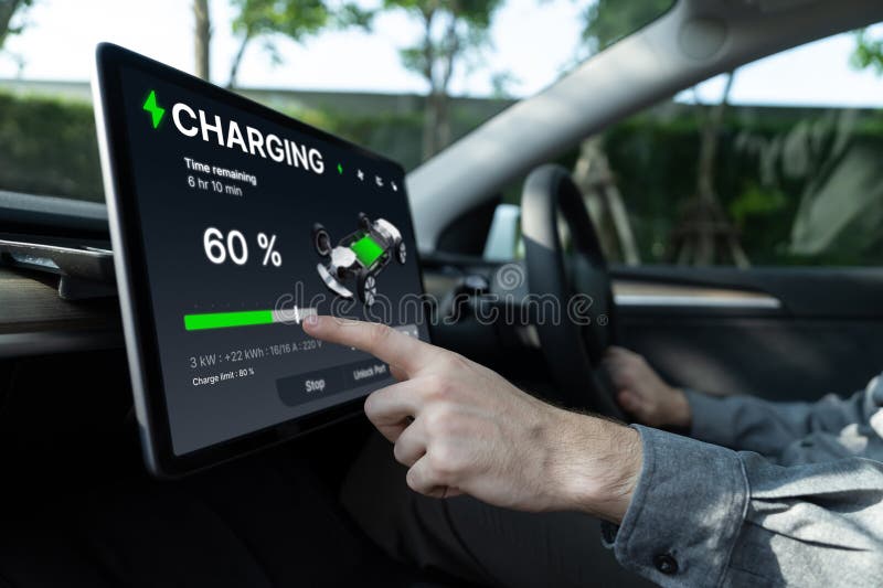 Electric Car Driver Checks Battery Charging Status App Screen in Car ...