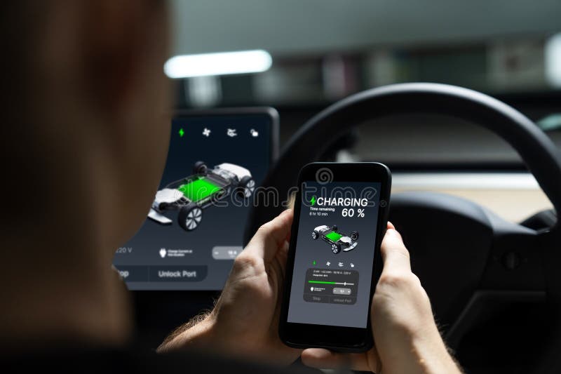 Electric Car Driver Checks Battery Charging Status App Screen in Car ...