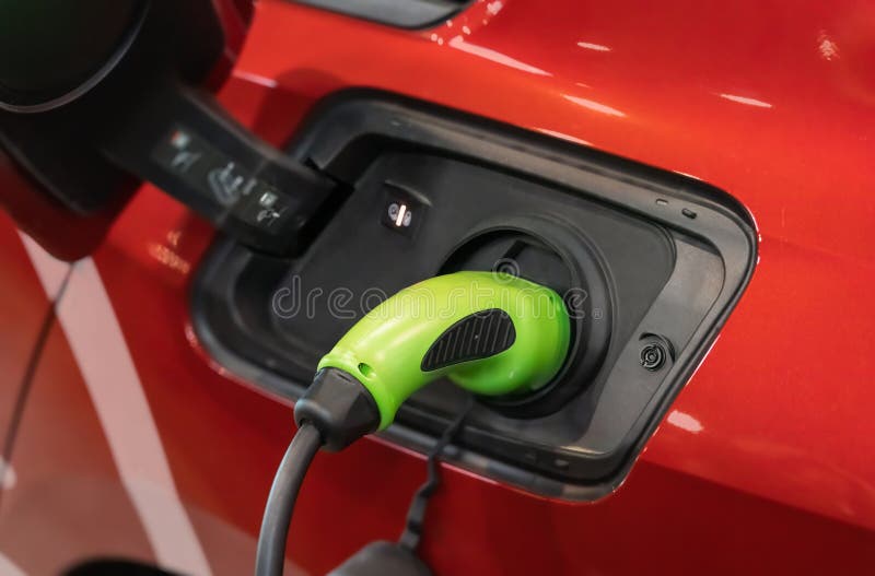 Electric Car (EV) is Charging in Socket with Cable Stock Photo - Image ...