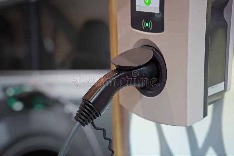 Electric Car (EV) is Charging in Socket with Cable Stock Photo - Image ...