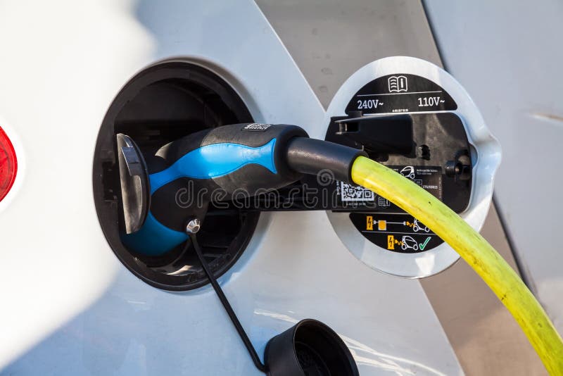 Electric car plug in stock image. Image of hybrid, electricity - 146294231