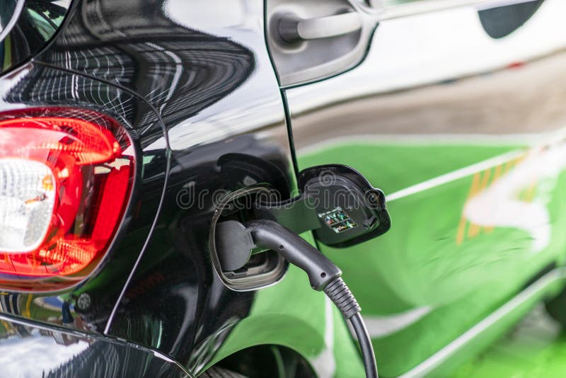 Electric Car with Plug-in Socket at Charge Station Charging Battery ...