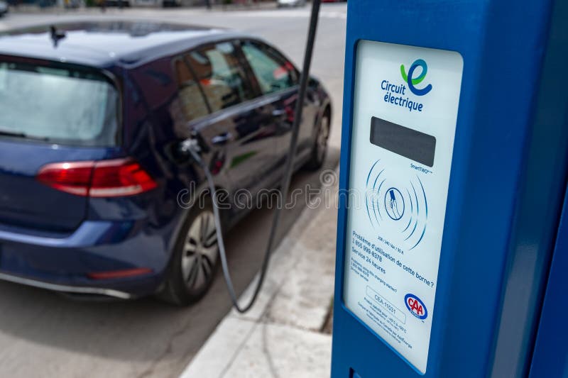 Electric Car Plugged into an EV Charging Station Editorial Image ...