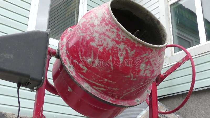 Electric Concrete Mixer Machine Working on a Construction Site. Stock ...