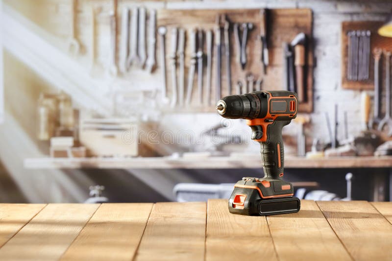 Electric Cordless Drill Screwdriver Tool on Wooden Work Table in Crafts ...