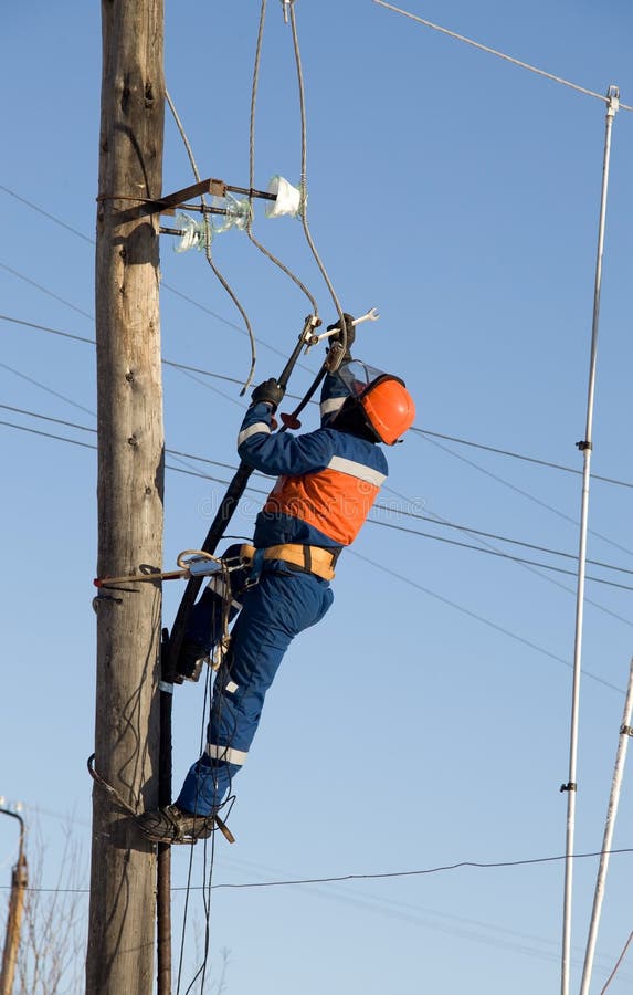 Power Electrician Lineman at Work on Pole Stock Photo - Image of ...