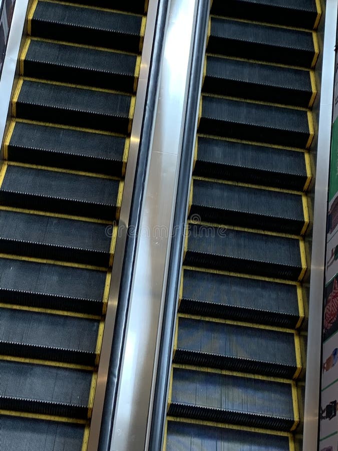 Electric escalators stock image. Image of black, engineering - 327285503