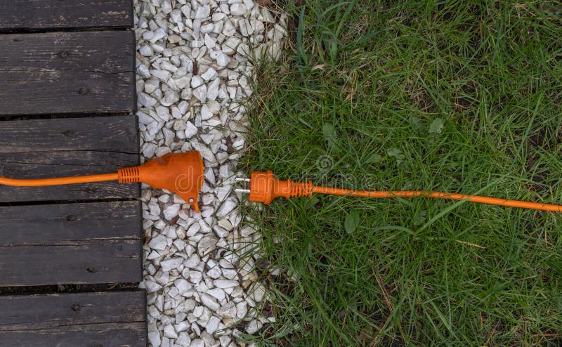 Electric Extension Cord and Power Connection in the Garden Stock Photo ...