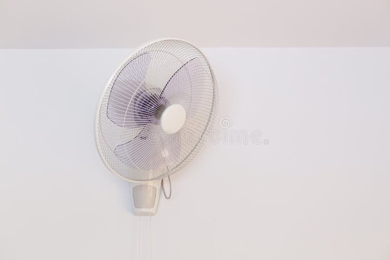 Electric Fan Hanging on White Wall Stock Photo - Image of condition ...