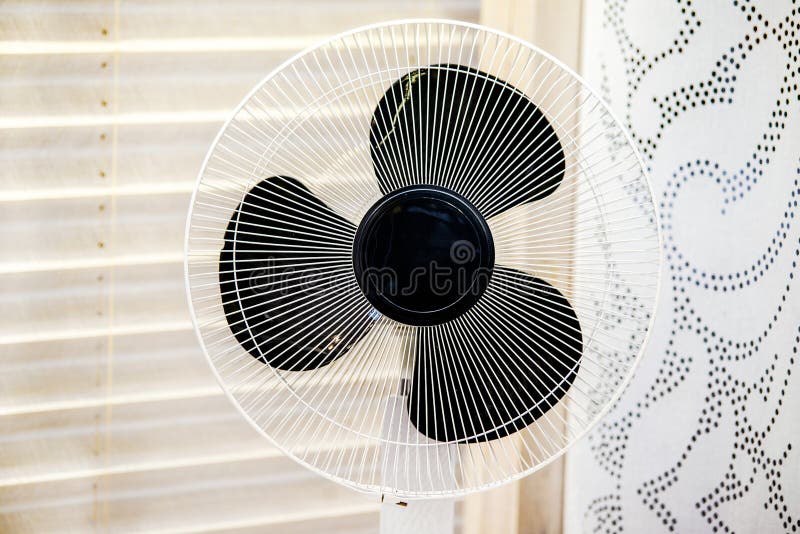 Electric Fan Stands Near the Window Stock Photo - Image of ventilator ...