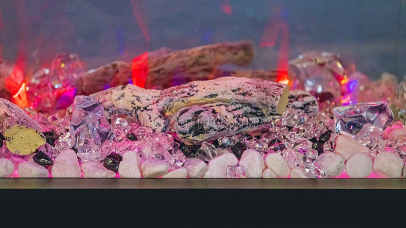 Electric Fireplace Pink stock photo. Image of pebbles - 262198384