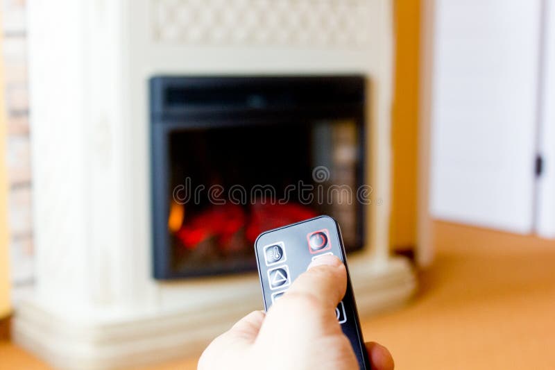 Electric Fireplace Remote Control Stock Photo - Image of living ...