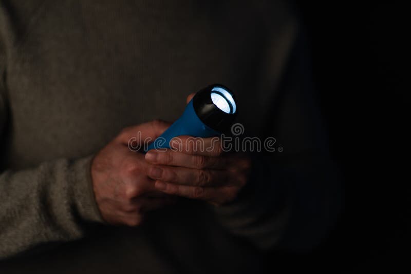 Electric Flashlight Glowing in Darkness in Stock Photo - Image of ...