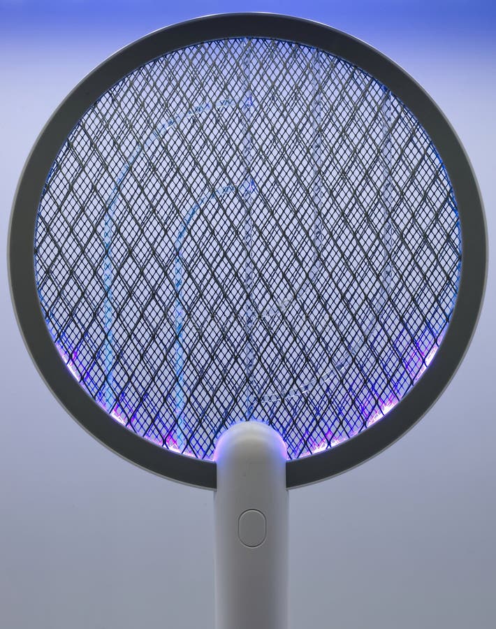 Electric Fly and Mosquito Swatter on Charging Base Switched on Stock ...