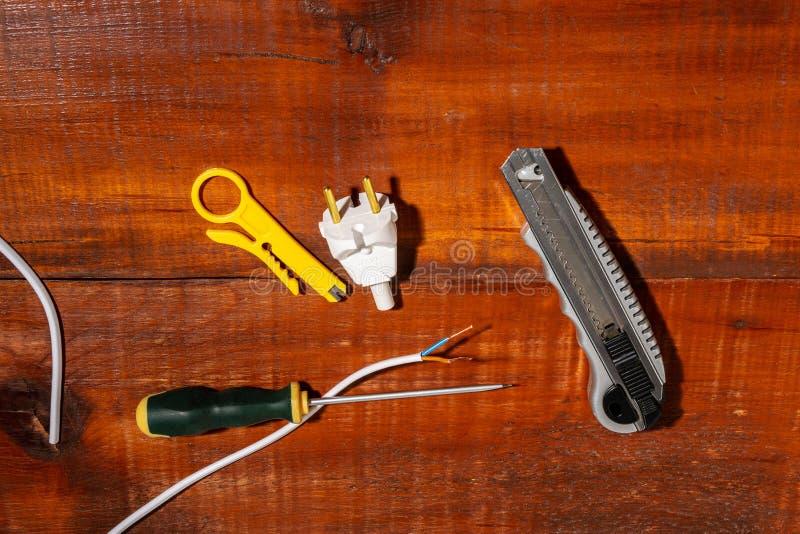 An Electric Fork, Wires and a Screwdriver Lie on a Wooden Table. Stock ...