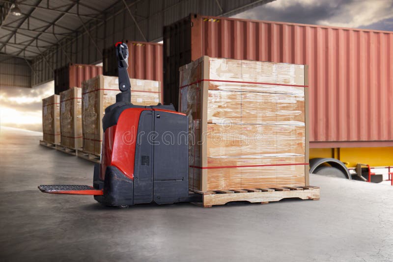 Electric Forklift Pallet Jack with Packaging Boxes Stacked on Pallet ...