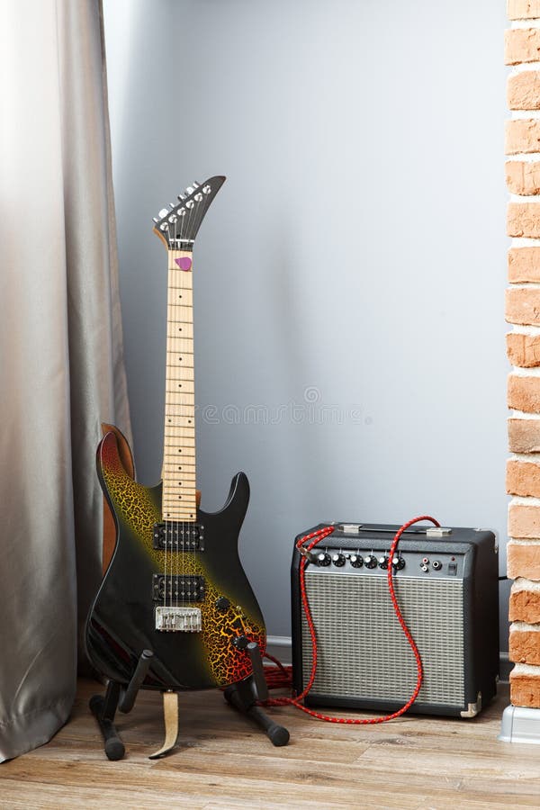Electric guitar and amp stock image. Image of volume - 70406787