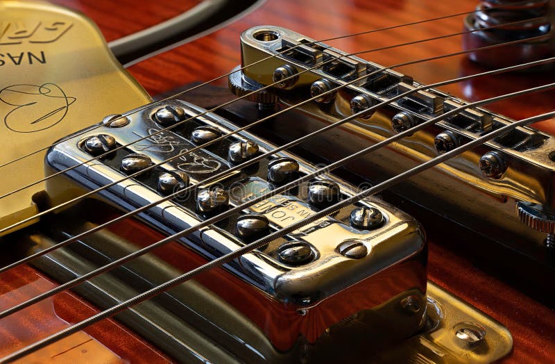 Electric Guitar with Six Strings and Various Knobs and Switches on Its ...