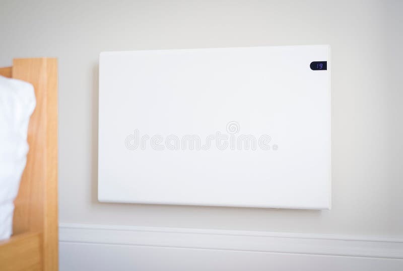 Electric Heating Panel Radiator on a Bedroom Wall, UK Home Stock Photo ...
