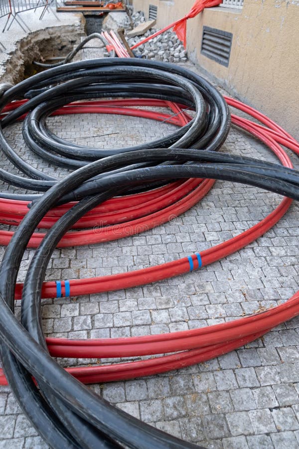 Electric and High-speed Internet Network Cables in Red Corrugated Pipe ...