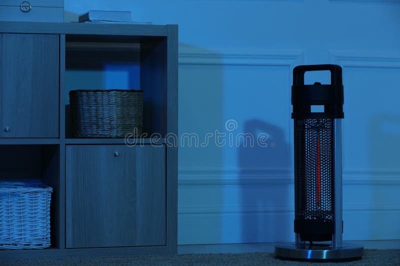Electric Infrared Heater in Dark Room Stock Photo - Image of control ...