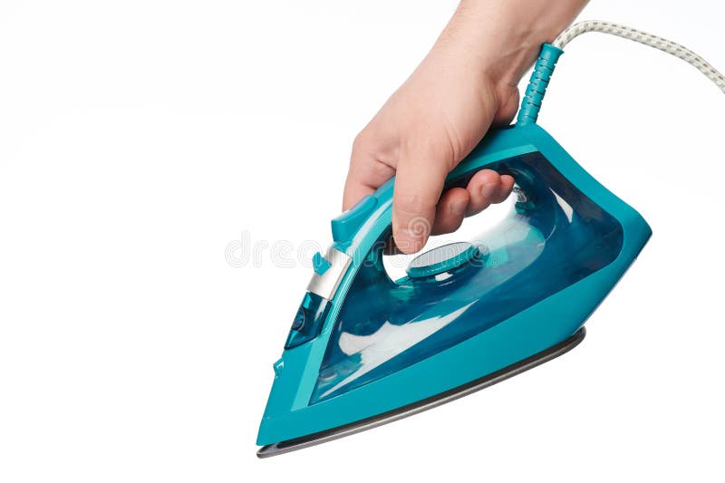 Electric iron in hand stock photo. Image of steam, routine - 218137124