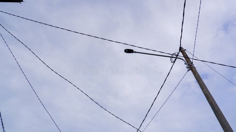 An Electric Lamp Post with a String of Cables Stock Image - Image of ...