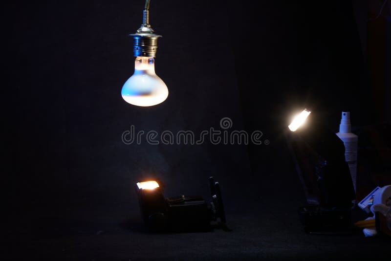 Electric Light Bulb and Flashlights in the Darkness Stock Image - Image ...