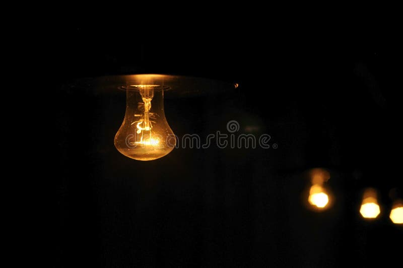 Electric Light Bulb Shines Dimly in the Dark Stock Photo - Image of ...