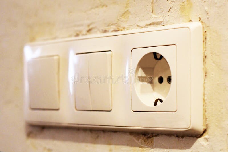 Electric Light Switch and Socket on the Empty Wall, Electrical Power ...