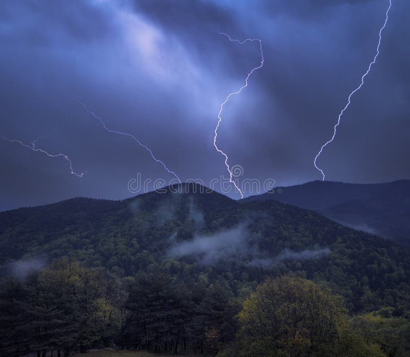 Electric Lightning Strikes Dramatic Night Sky in Powerful Thunderstorm ...