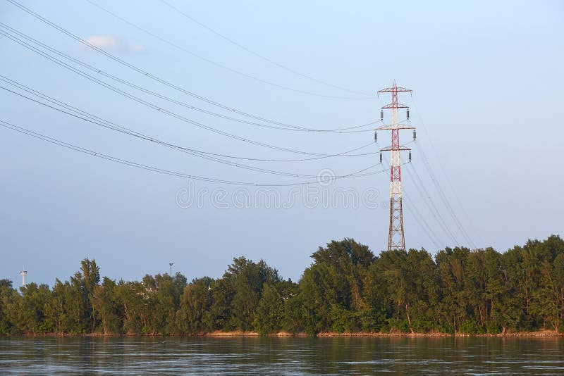 Electric lines over river stock photo. Image of electric - 198748490