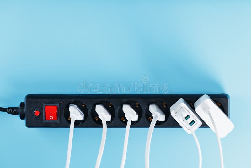 A Black Mains Filter with Electrical Outlets Inserted into it with ...