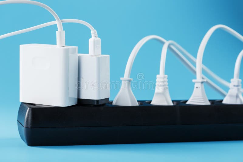 Electric Mains Filter with Inserted White Plugs of Electrical ...