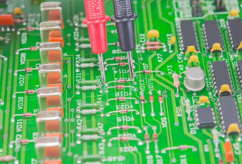 Multimeter Probes Examining a Computer Circuit Board Stock Photo ...