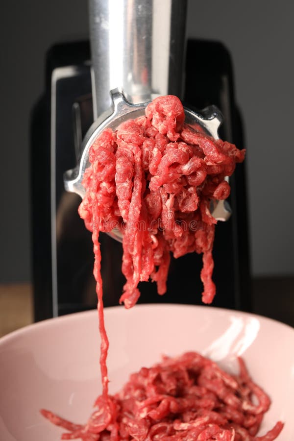 Electric Meat Grinder with Beef Mince on Table, Closeup Stock Photo ...