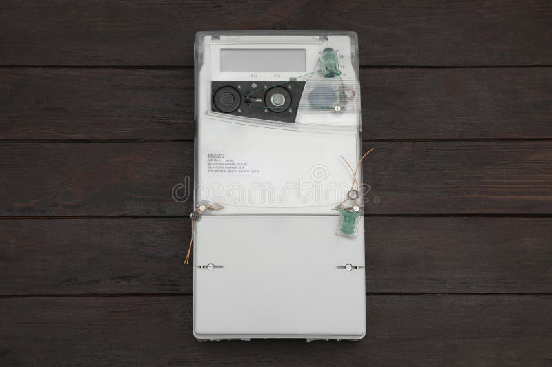 Electric Meter on Wooden Background, Top View. Measuring Device Stock ...