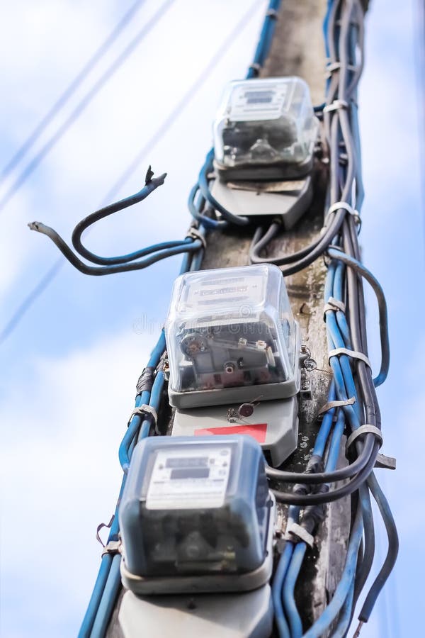 Electric Meters for Home on Pole on Blue Sky Background Stock Photo ...