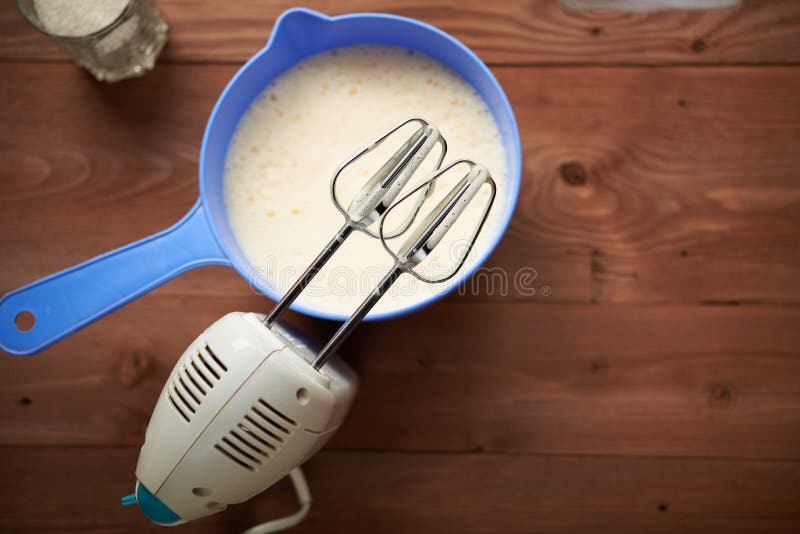 Electric mixer beats egg stock image. Image of mixed - 80279121