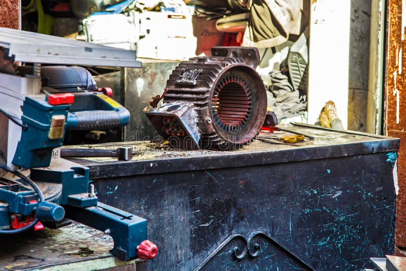 Electric Motor and Mechanical Tools for Reparation in Garage Stock ...