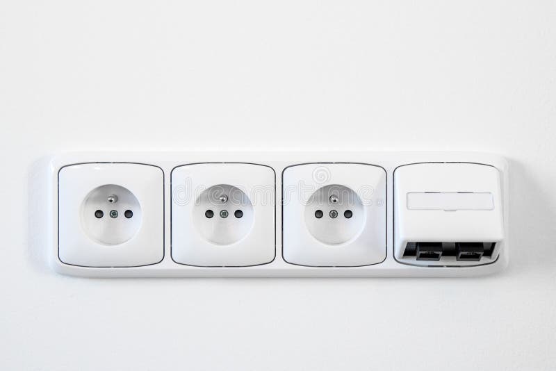 Electric and Network Plugs on a White Wall Stock Image - Image of ...