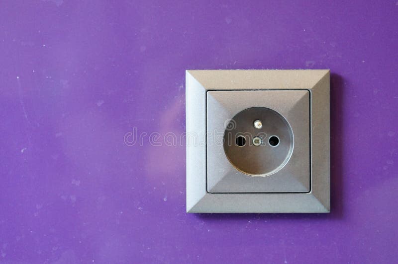 Electric Outlet on a Purple Wall Stock Image - Image of isolated, green ...